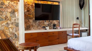 Suíte estúdio design | Área de estar | TV LED 50 polegadas com canais a cabo, TV