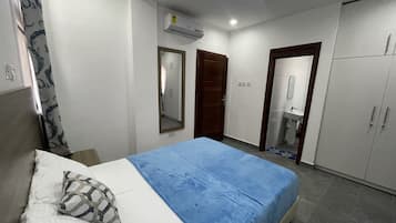 Apartamento Comfort | Casa de banho | Roupões