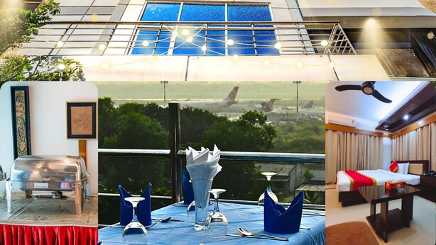 Um hotel com uma placa grande indicando "Hotel Air Inn" e um terraço no telhado com vista para o céu e árvores.