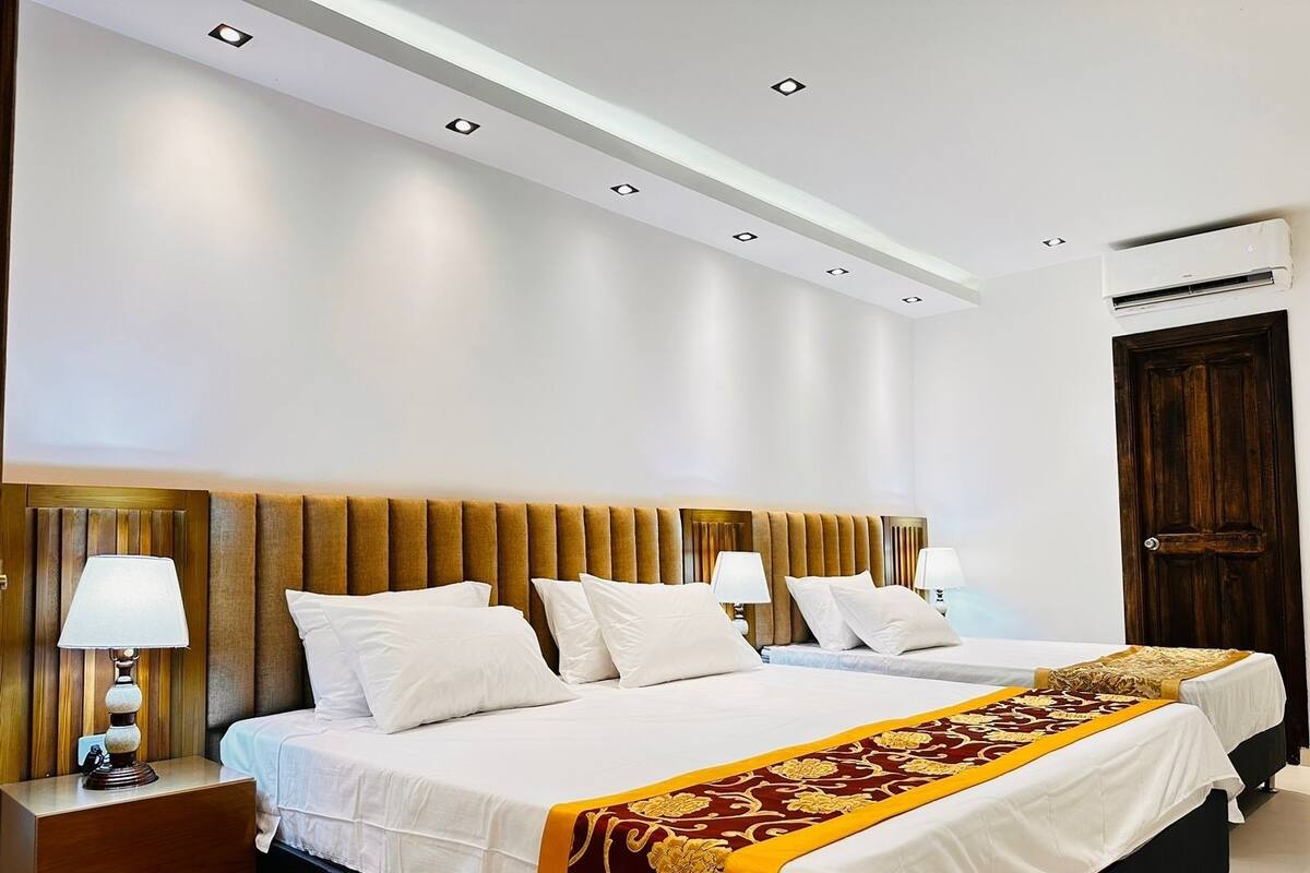 Quarto Quádruplo Elite | Wi-fi grátis, com decoração personalizada, com mobília individualizada