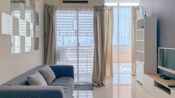 Apartamento Deluxe, 2 quartos | Sala de estar