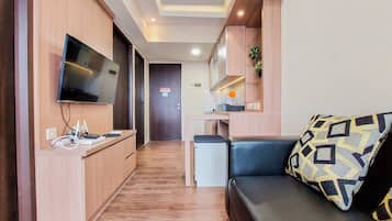 Apartamento Deluxe | Sala de estar