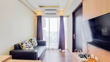 Apartamento Deluxe | Sala de estar