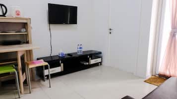 Apartamento Deluxe, 1 quarto | Sala de estar