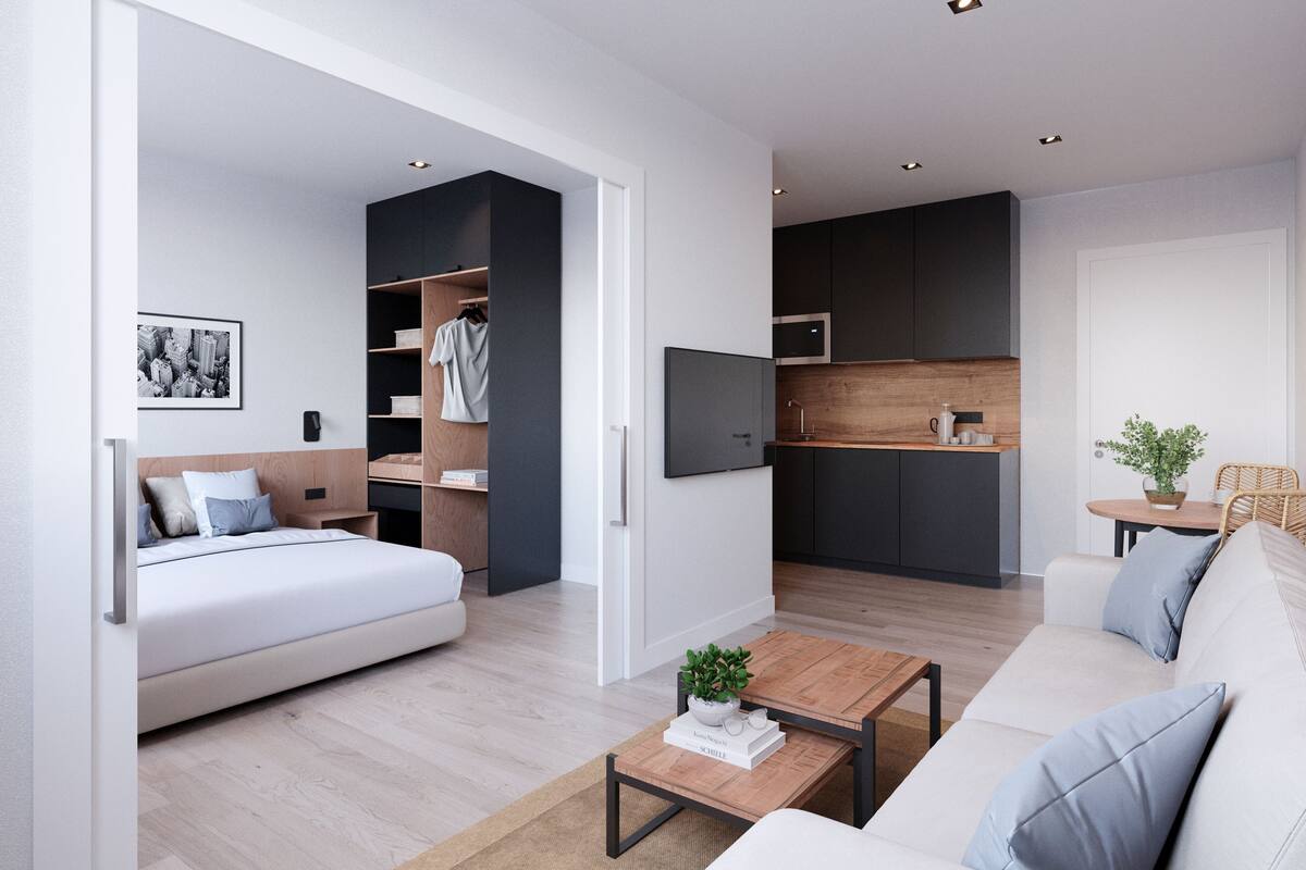 Um apartamento moderno com sala de estar, área de jantar e cozinha compacta.