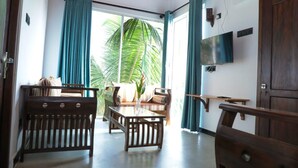 Apartamento Deluxe | Sala de estar
