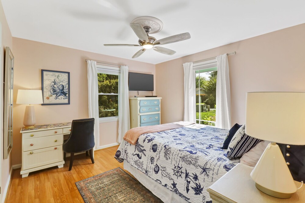 Walk to the beach down a shady path from this charming 3 bedroom ...