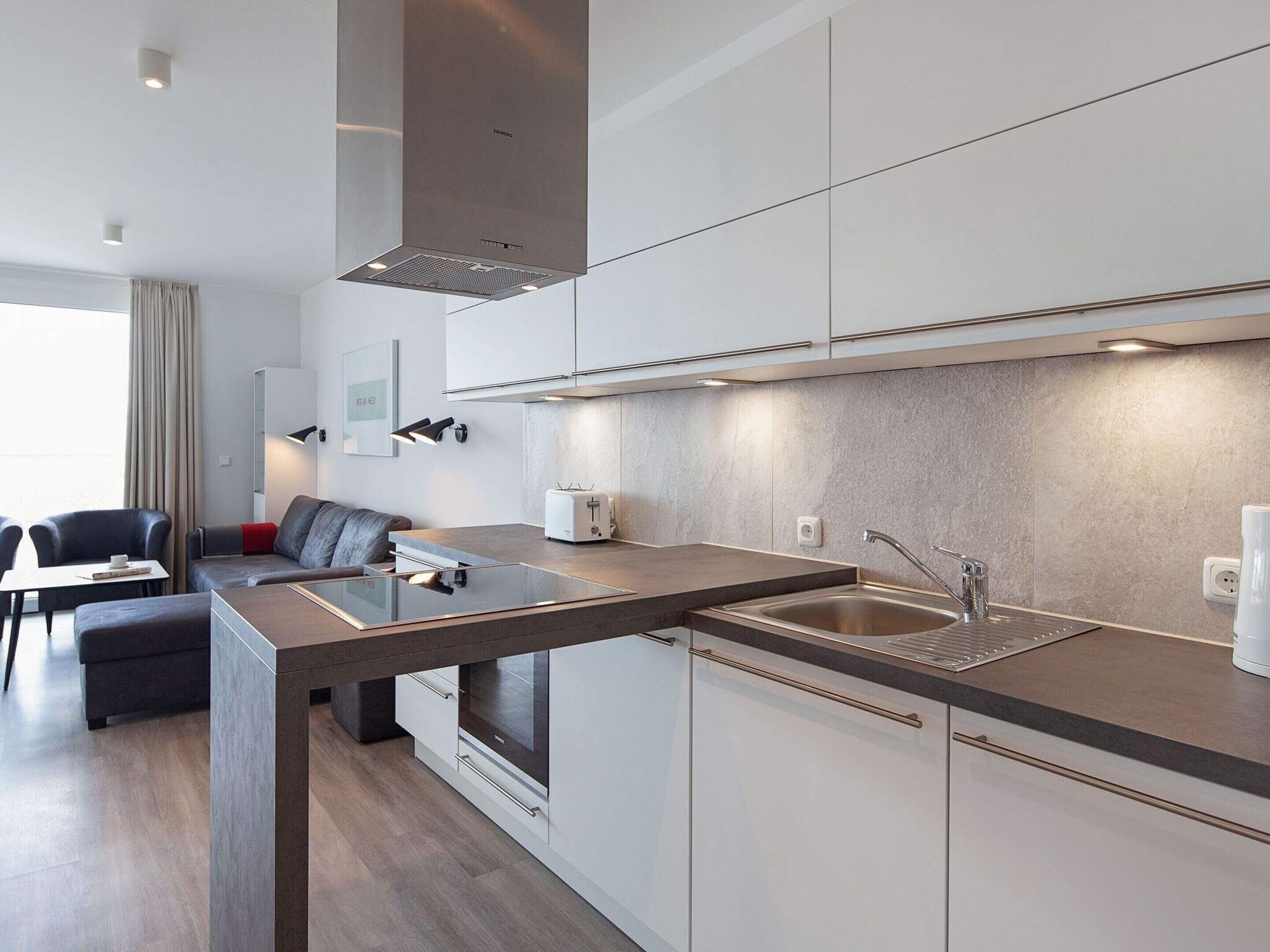 Apartamento | Cozinha privada | Um frigorífico 