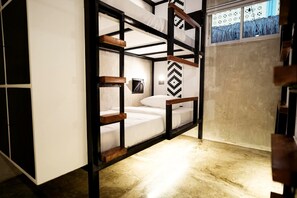 Dormitório compartilhado com design assinado, em dormitório misto