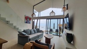 Villa Signature | Sala de estar | Smart TV de 65 de polegadas com canais digitais, televisor, Netflix 