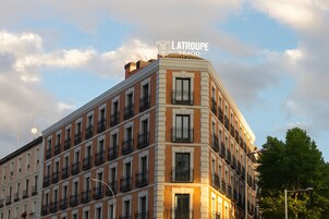 A multi-story building with a prominent sign reading "LATROUE PRAD".