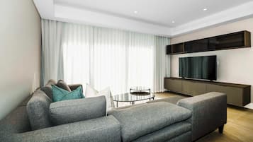 Apartamento | Área de estar | TV