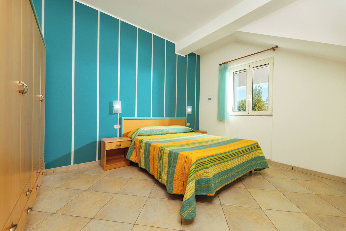 Apartamento Superior | Cofre no quarto, quartos insonorizados, berço de viagem 