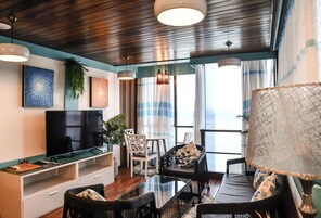 Suite Deluxe, 1 cama king-size, vista para a praia, junto à praia | Sala de estar