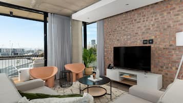 Apartamento conforto | Área de estar | TV de tela plana 40 polegadas com canais a cabo, TV