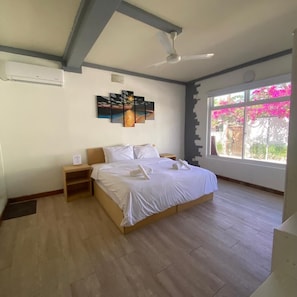Quarto quádruplo standard | Roupas de cama premium, individualmente mobiliados, Wi-Fi de cortesia