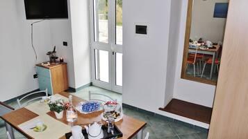 Apartamento, 1 quarto, varanda, vista para o oceano | Sala de jantar
