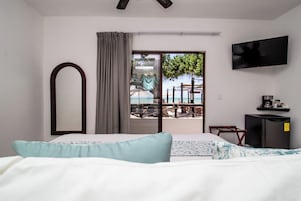Suite, 1 cama king-size, vista para o oceano | Comodidade do quarto