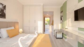 Quarto luxo | Frigobar, Wi-Fi de cortesia, roupa de cama