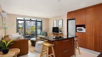 Apartamento exclusivo | Área de estar | TV de tela plana 50 polegadas com canais a cabo, TV, Netflix