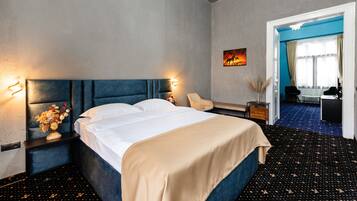Suite Deluxe | Secretária, cortinas/cortinados opacos, quartos insonorizados