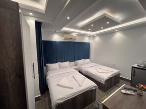 Quarto Deluxe | Lençóis de algodão egípcio, roupa de alta qualidade, minibar grátis