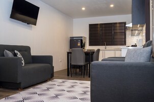 Apartamento | Área de estar | TV de tela plana