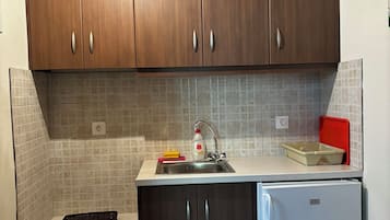 Quarto casal conforto | Cozinha americana privada | Frigobar, cooktop, talheres/pratos/utensílios de cozinha