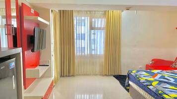 Apartamento superior | Escrivaninha, roupa de cama
