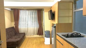 Apartamento superior | Escrivaninha, roupa de cama