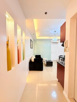 Apartamento Comfort em Condomínio Fechado, 1 quarto, vista para o mar | 1 quarto, roupa de alta qualidade, edredões de penas, secretária 