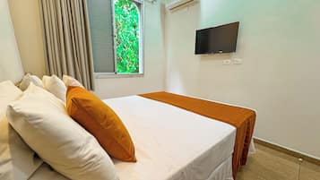 Quarto luxo | Frigobar, Wi-Fi de cortesia, roupa de cama
