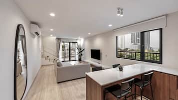 Apartamento, 1 quarto | Área de estar | Smart TV 55 polegadas com canais digitais, TV, Netflix