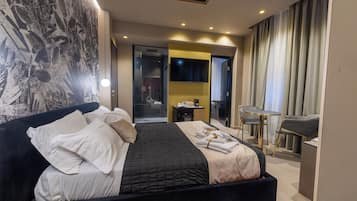 Suite Deluxe | Edredões de penas, minibar com produtos grátis