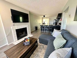 Apartamento família, 2 quartos | Área de estar