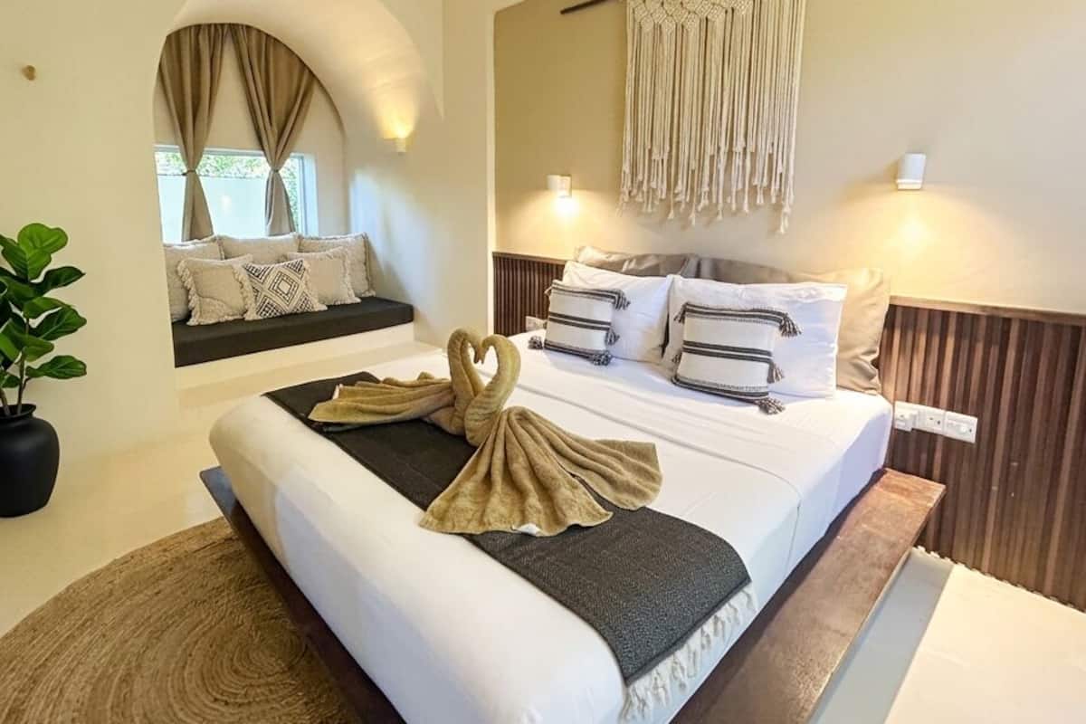 Apartamento Familiar | Minibar, cofre no quarto, com decoração personalizada