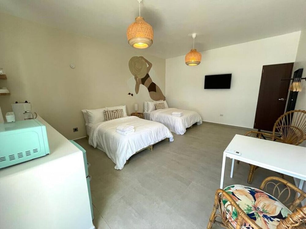 Family Room at Corcega Beachfront Suites - Rincon | Vrbo