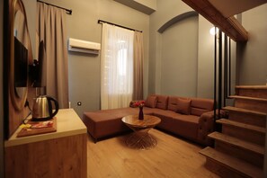 Quarto quádruplo design | Roupas de cama premium, frigobar (abastecido com itens grátis)