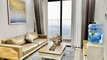 Apartamento superluxo, 2 quartos, vista para a cidade | Área de estar | TV