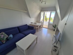 Apartamento luxo | Área de estar | TV de tela plana