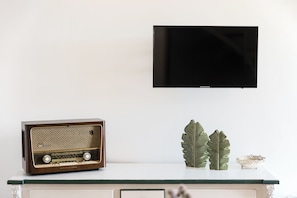Suite Deluxe | Sala de estar | Smart TV