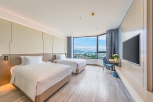 Quarto duplo luxo, vista parcial para o mar | Roupas de cama premium, camas com colchões pillow-top, frigobar
