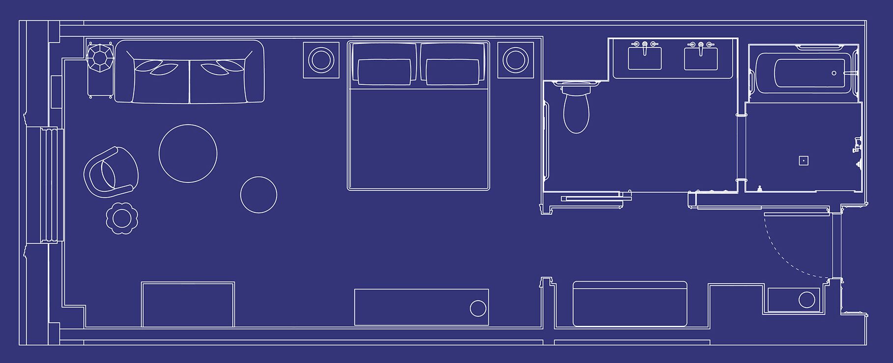 Planta baixa de um hotel com um quarto amplo, um banheiro, uma cozinha compacta e uma sala de estar.