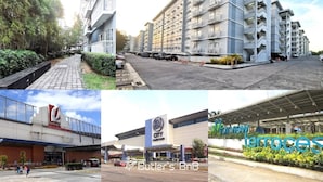 Um edifício moderno com vários andares, área de estacionamento coberta e placa indicando uma feira na cidade.