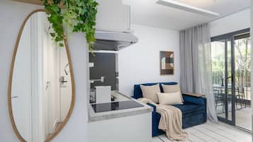 Apartamento Executivo | Sala de estar | Televisor
