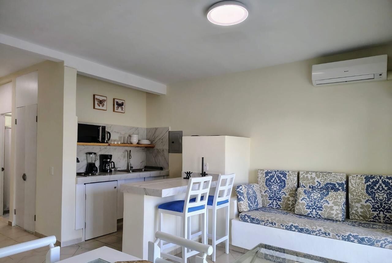 Apartamento | Área de estar | TV de tela plana 65 polegadas com canais a cabo