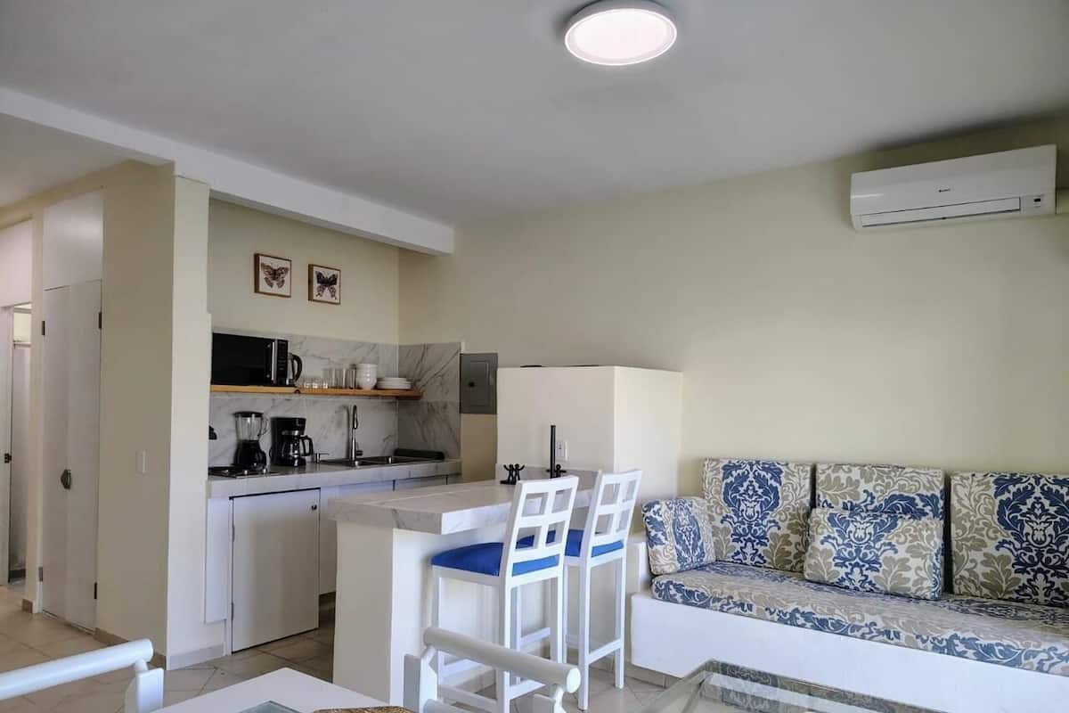 Apartamento | Área de estar | TV de tela plana 65 polegadas com canais a cabo
