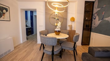 Apartamento superluxo | Área de estar | Smart TV 55 polegadas com canais a cabo