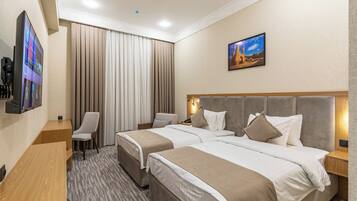 Roupa de alta qualidade, minibar, cofre no quarto