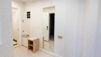 Apartamento Deluxe | Sala de estar | Smart TV, filmes pagos